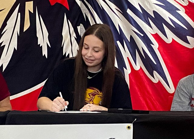 Lexie Starnes makes history signing cheer scholarship with Emmanuel ...